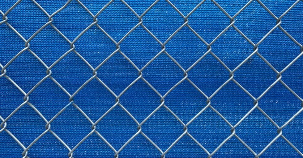 Windscreens vs. Slats: Exploring Chain Link Fence Covers