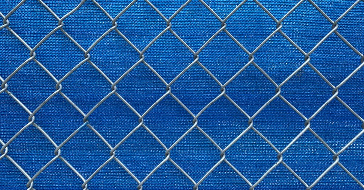 Windscreens vs. Slats: Exploring Chain Link Fence Covers